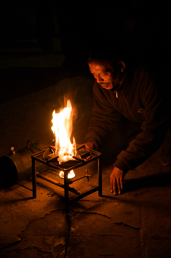 Man lighting stove - Kathmandu, Nepal | Shutterbug